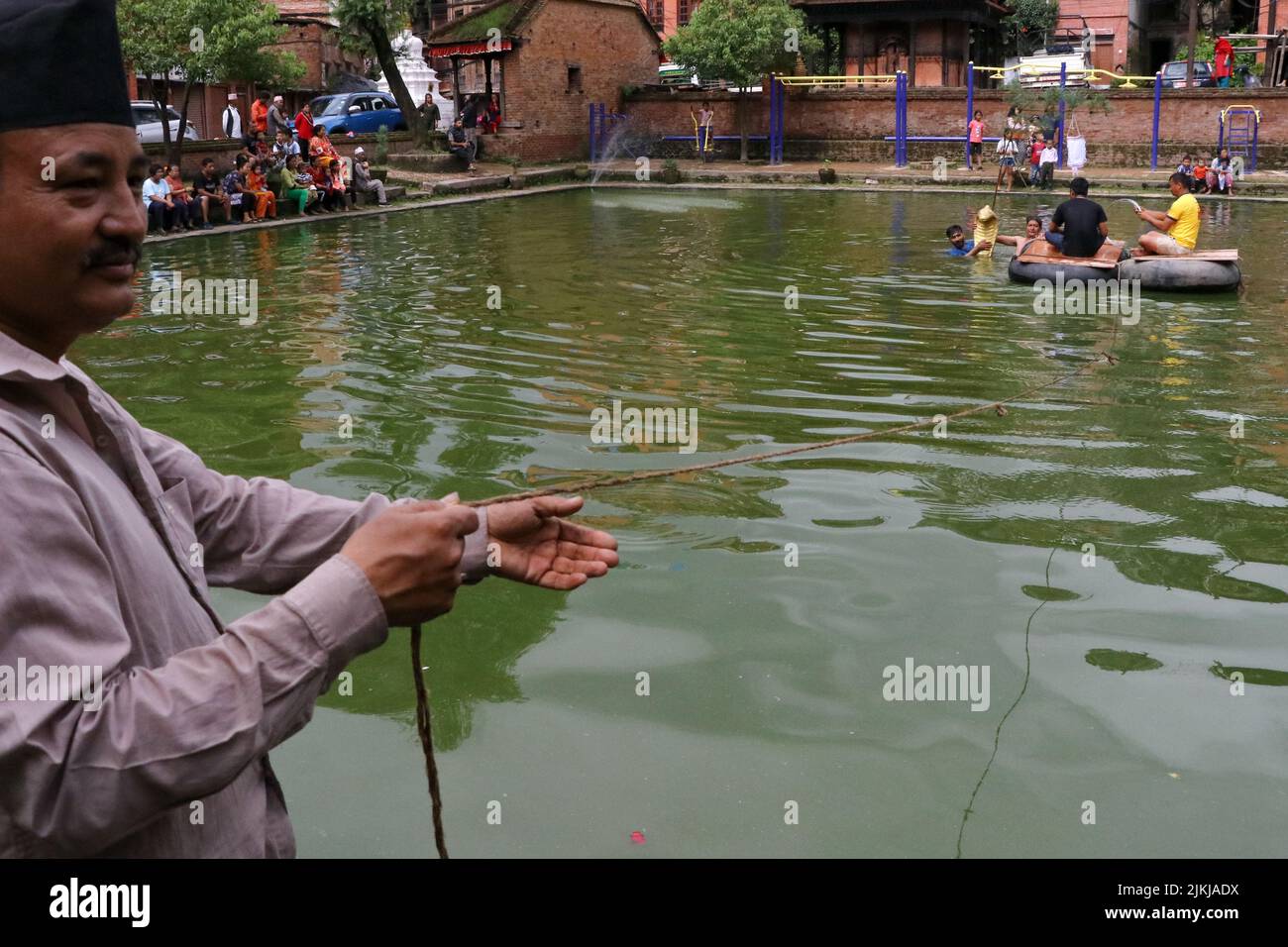 On Aug.2,2022 in Bhaktapur, Nepal. Locals of Bhaktapur clean the pond ...