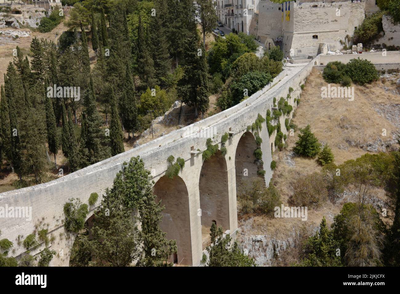The famous stone arcade bridge in Gravina, Puglia, Italy surrounded by ...