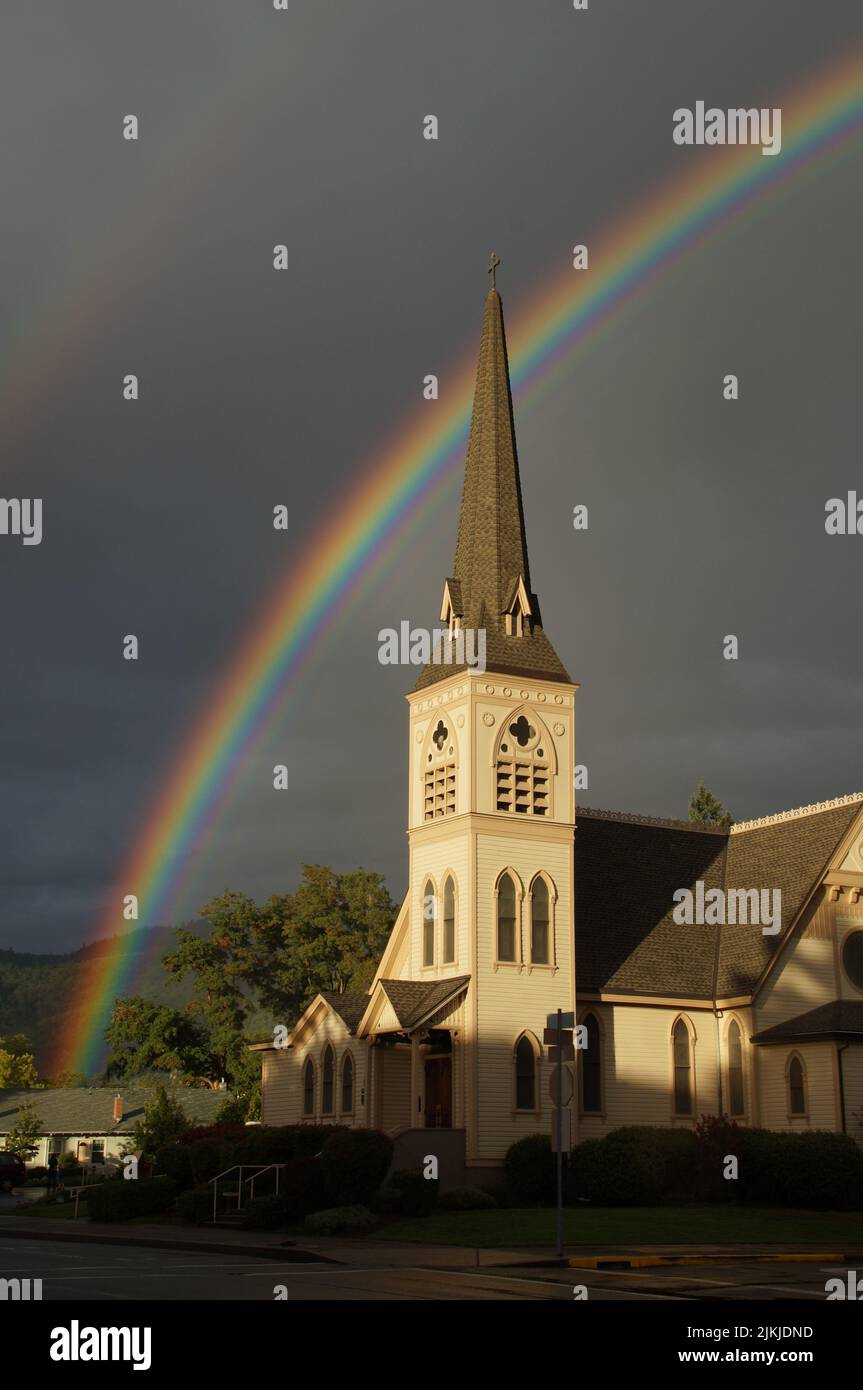 Rainbow over church hi-res stock photography and images - Alamy