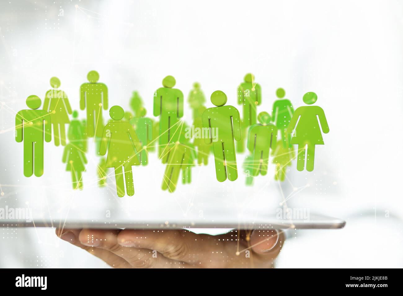 A hologram of interconnected people projecting from a man's tablet ...