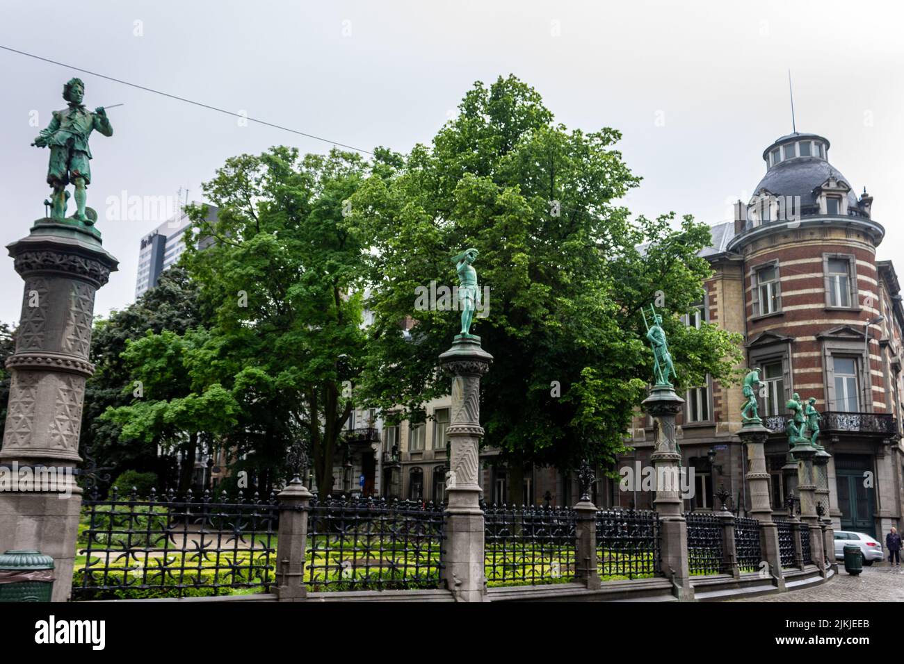 A beautiful shot of the Petit Sablon Square fences with blue statues ...
