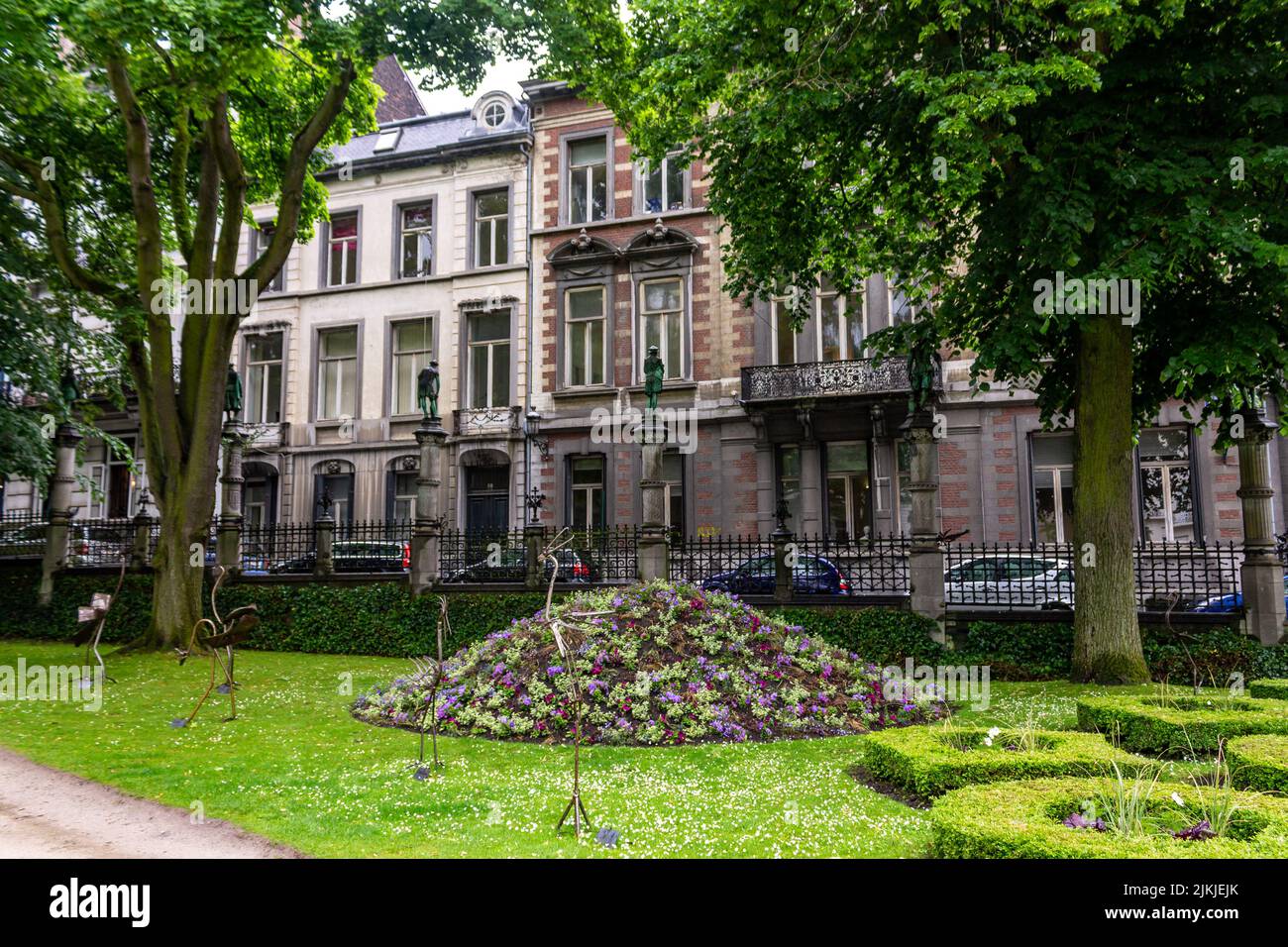 A bright shot of a hill of flowers monument in Petit Sablon Square in ...