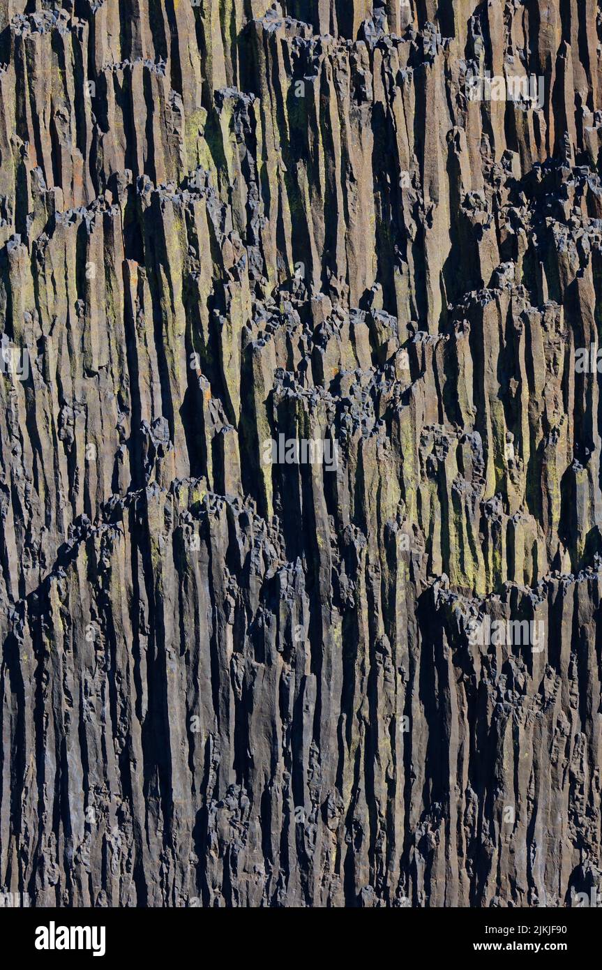 A vertical background of rock with linear layers Stock Photo - Alamy