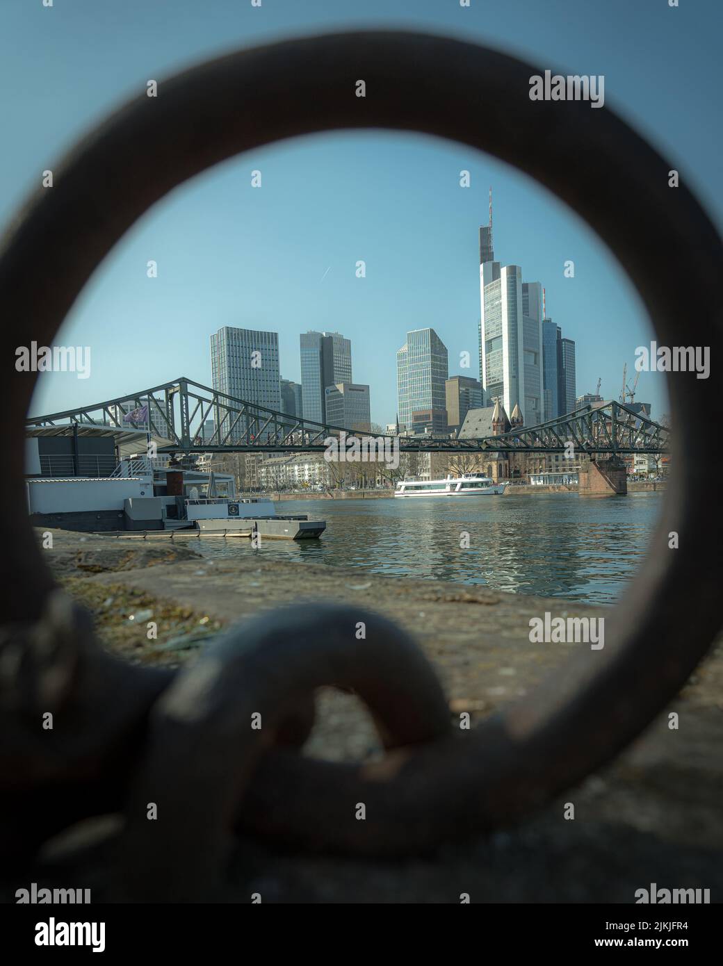 A view of the city from the chain on the shore of a river Stock Photo ...