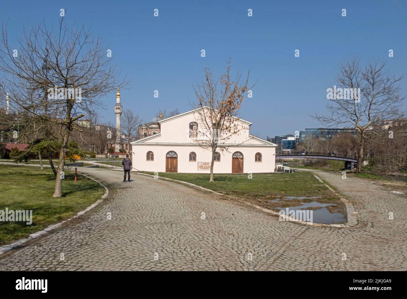 A white building in a park with tiled crossings in Kagithane district ...