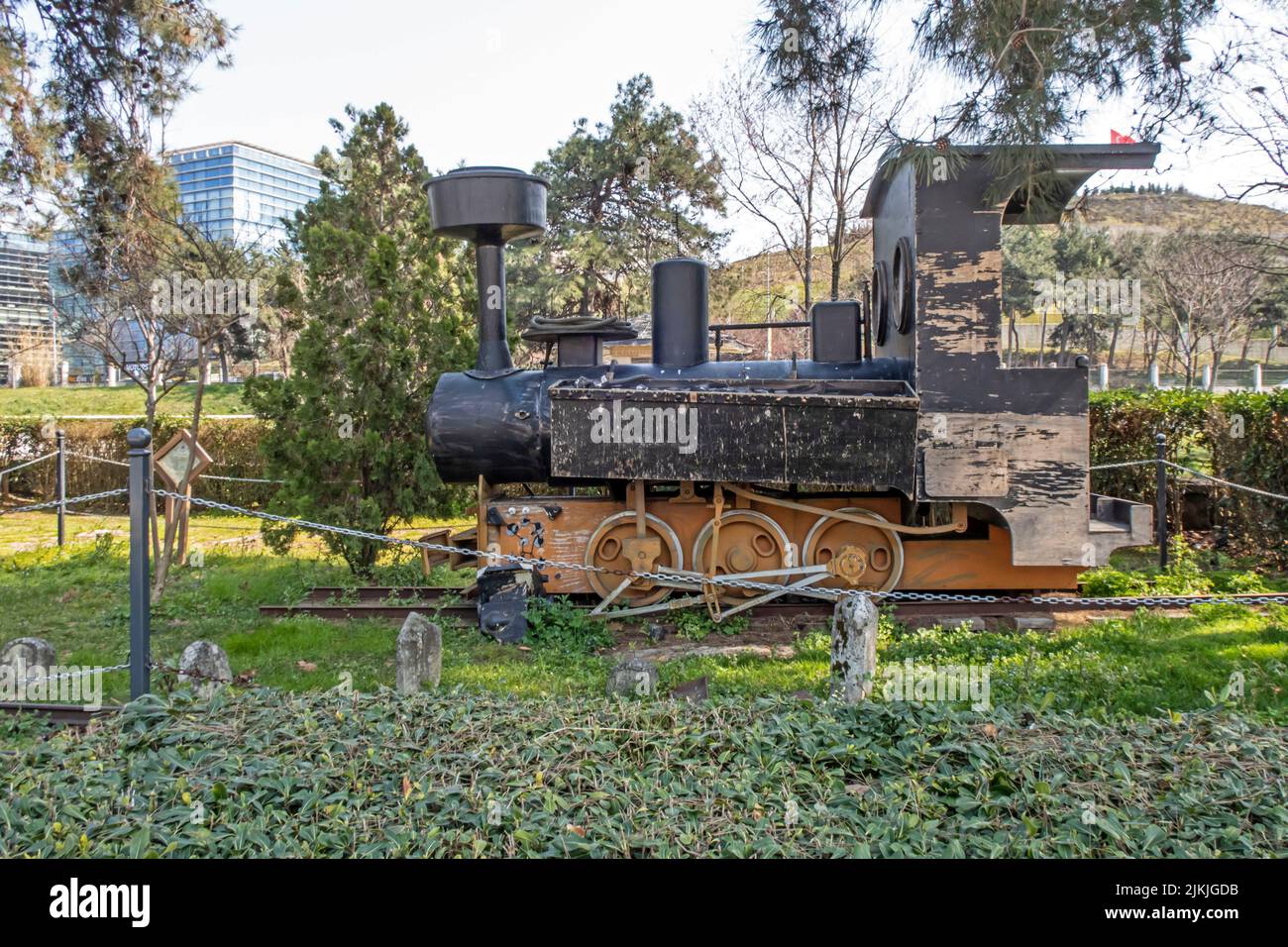 A wooden toy train in a park in Istanbul, Turkey under the bright ...