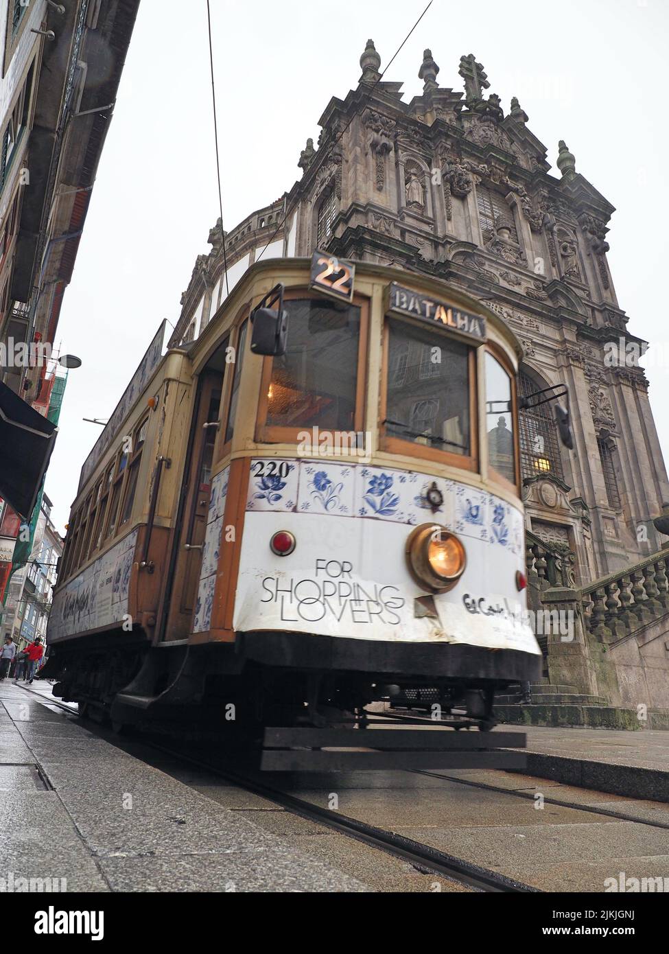 A traditional tram during day time at the city of Porto in Portugal ...