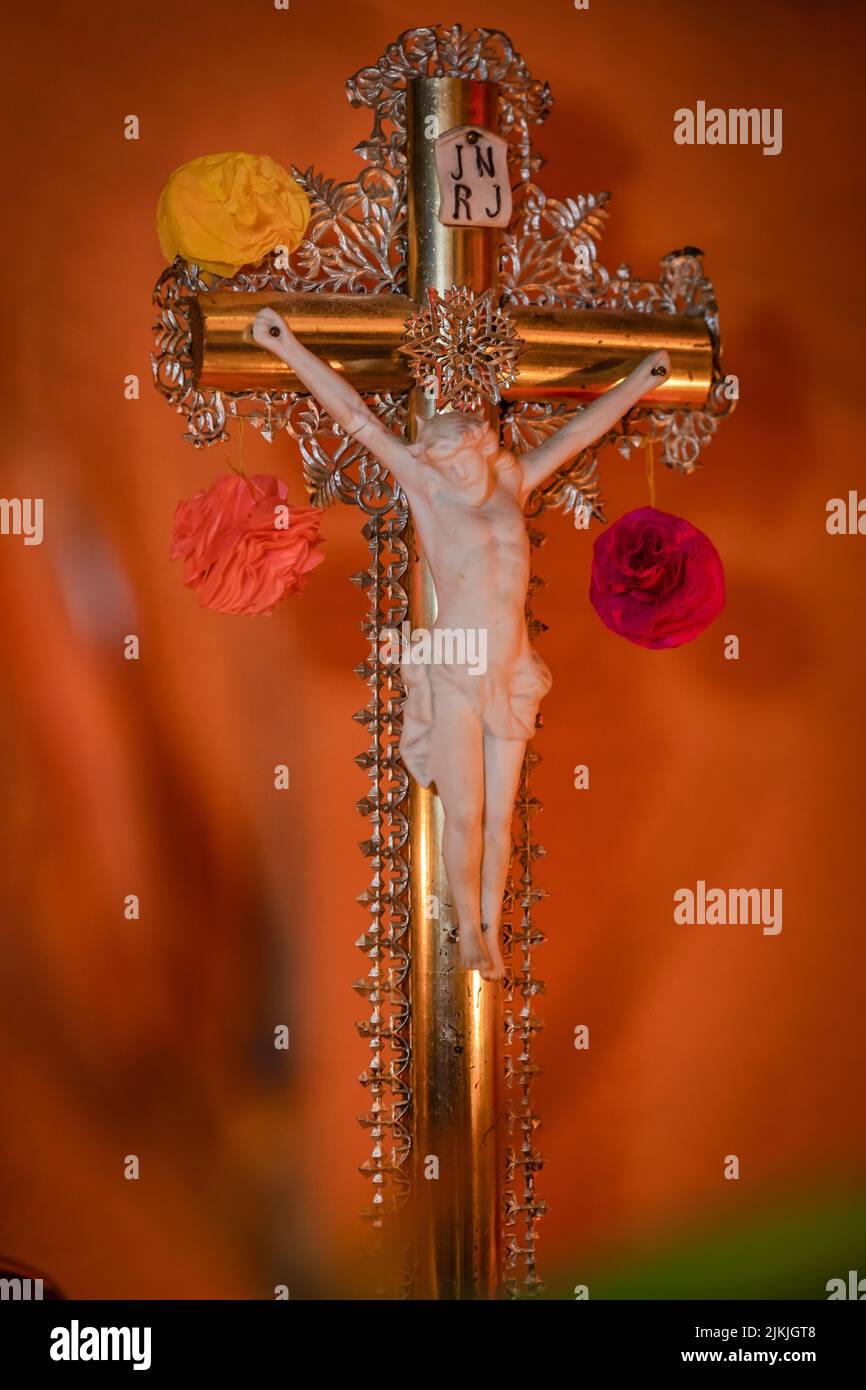 A vertical shot of a crucifixion of Christ with red background Stock ...