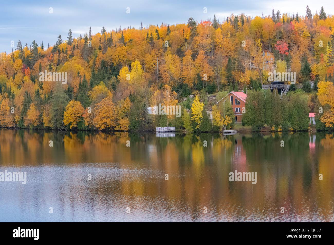 A Canada river red leaves forest Quebec house hut lake Stock Photo - Alamy