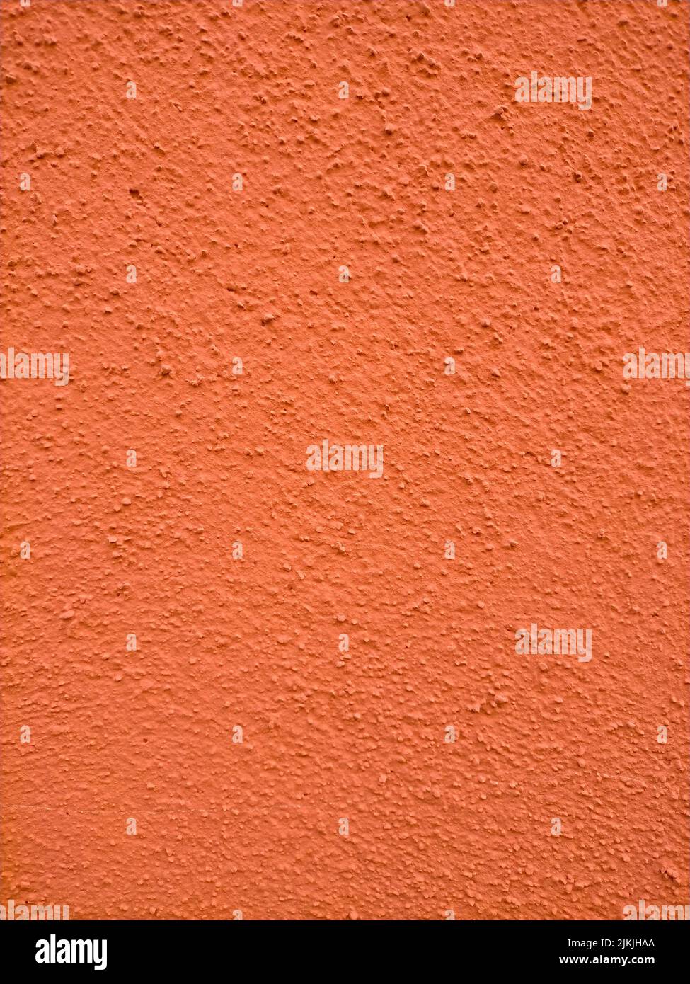 A orange painted stone wall texture with copy space Stock Photo - Alamy