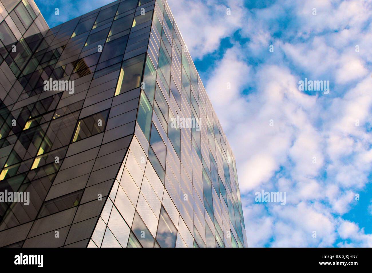 A low angle shot of a modern building with windows Stock Photo - Alamy