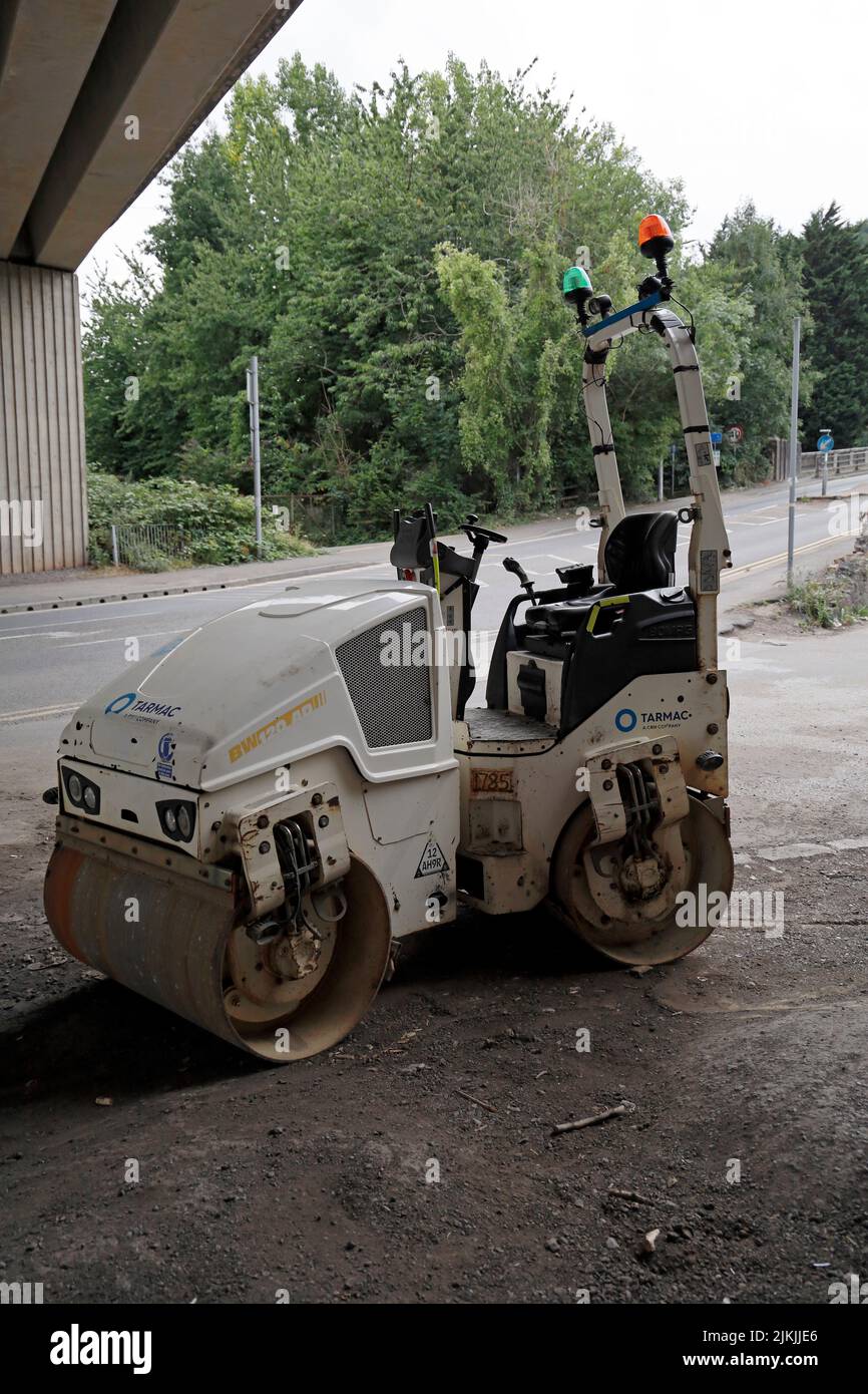 Mechanical road roller by the side of the road. Summer 2022 Stock Photo ...