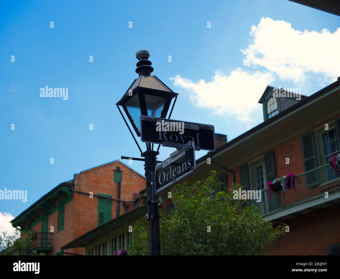 A view of a street light with signs in New Orleans Stock Photo - Alamy