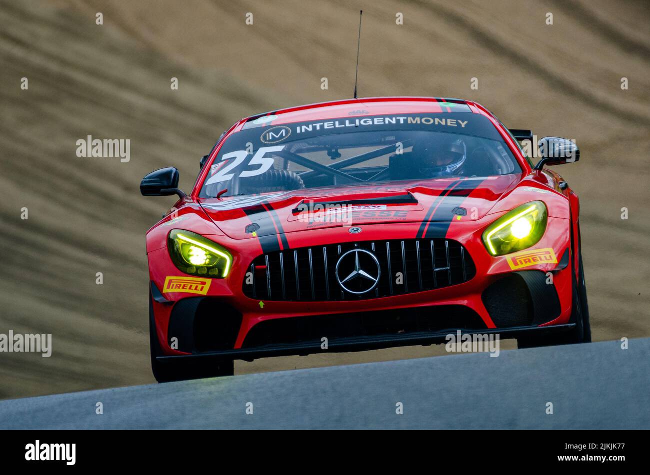A low angle shot of a Mercedes-AMG GT3 red car during the race in the ...