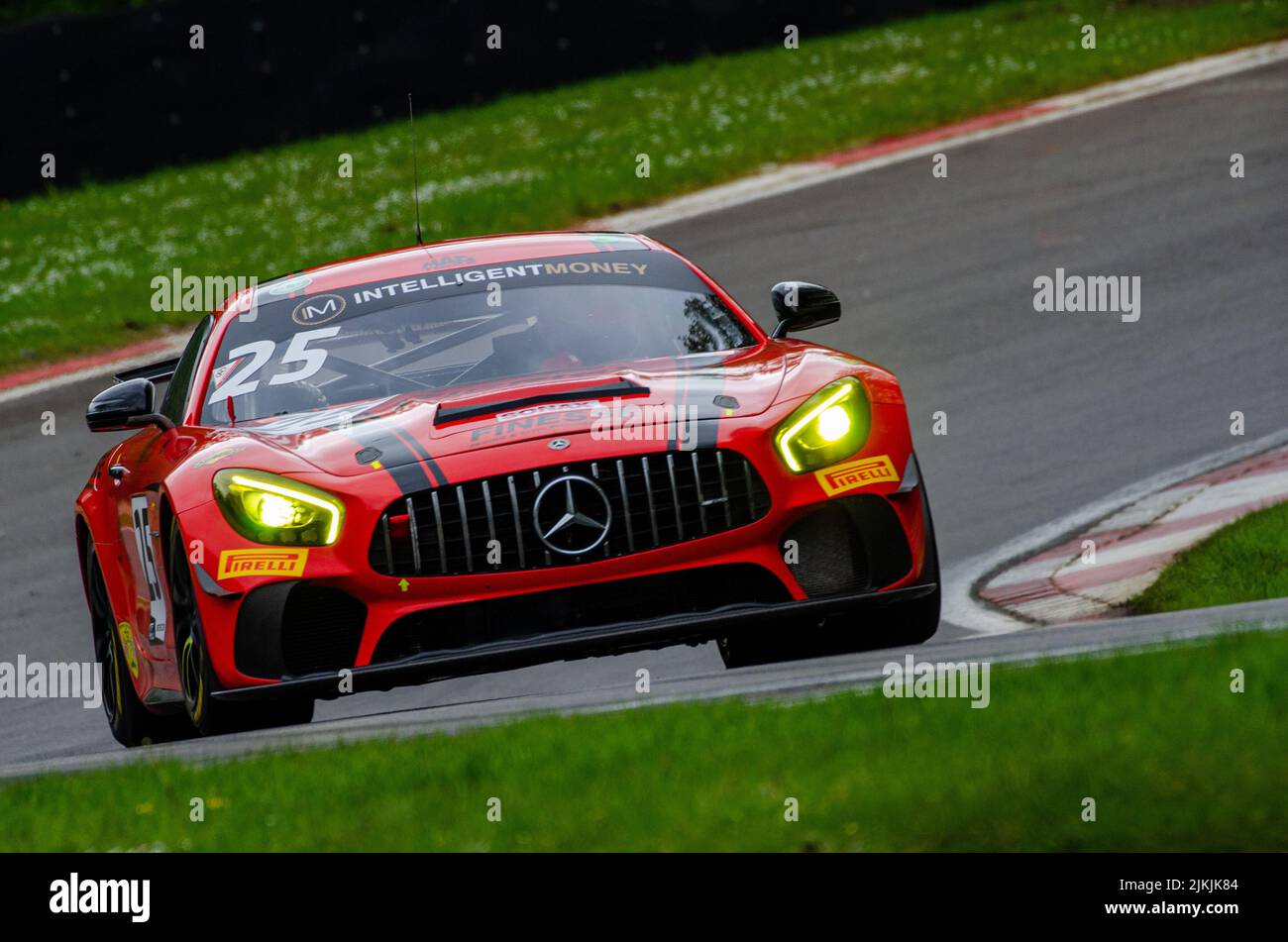 A low angle shot of a Mercedes-AMG GT3 red car during the race in the ...