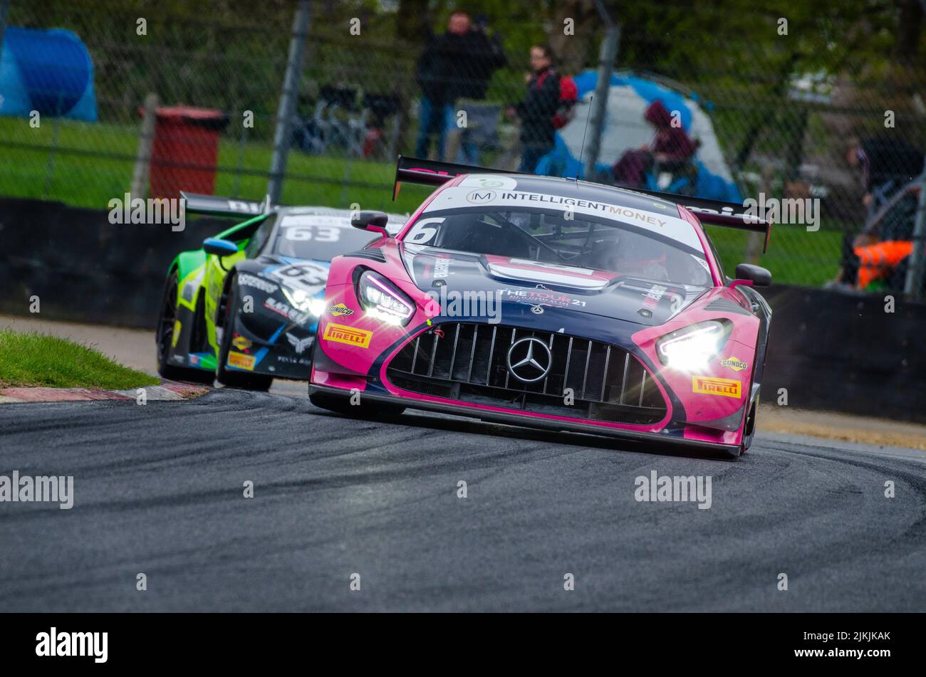 A low angle shot of a Mercedes-AMG GT3 pink and green car during the ...