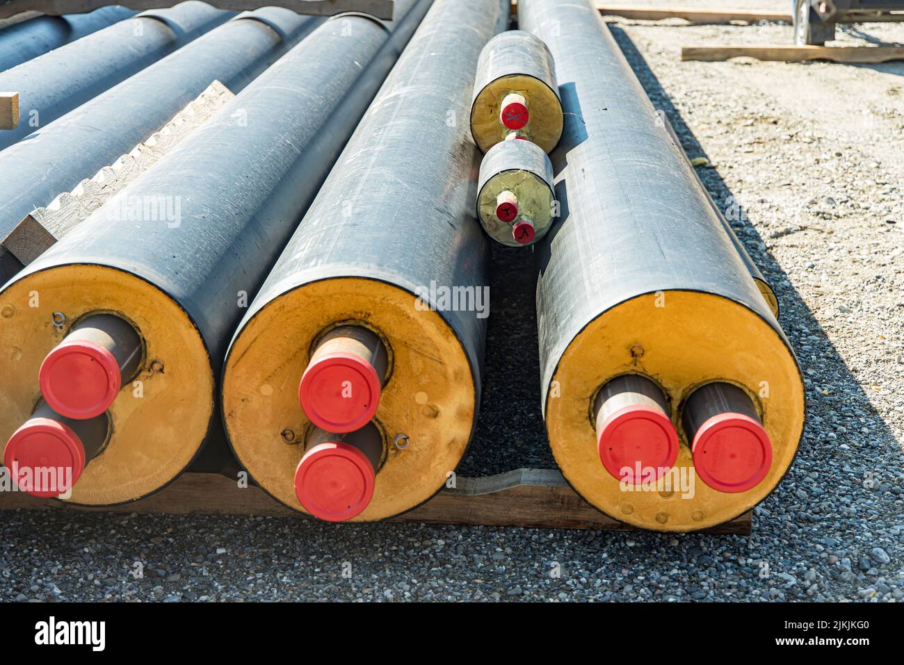Black pipes for local heating are ready for laying Stock Photo - Alamy