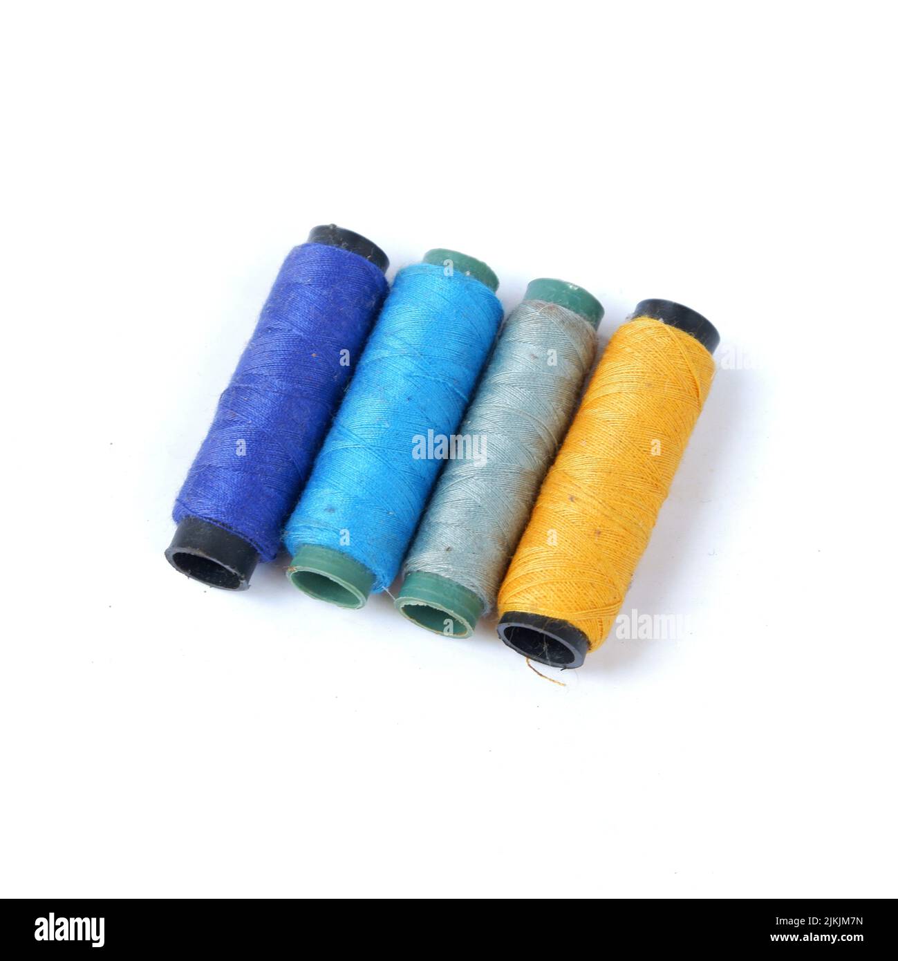 sewing thread isolated on a white background Stock Photo - Alamy