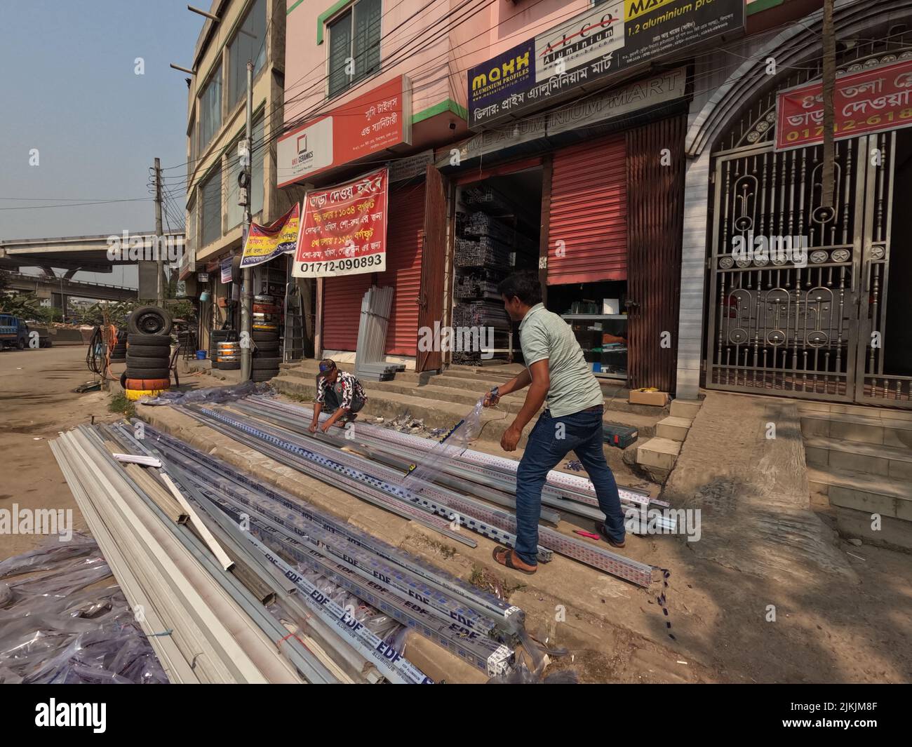 A beautiful shot of two male workers working in metal industries in the ...