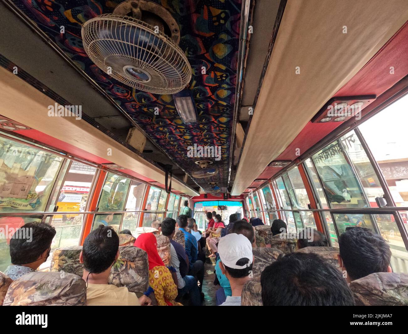 A beautiful shot of people sitting inside public bus transportation in ...