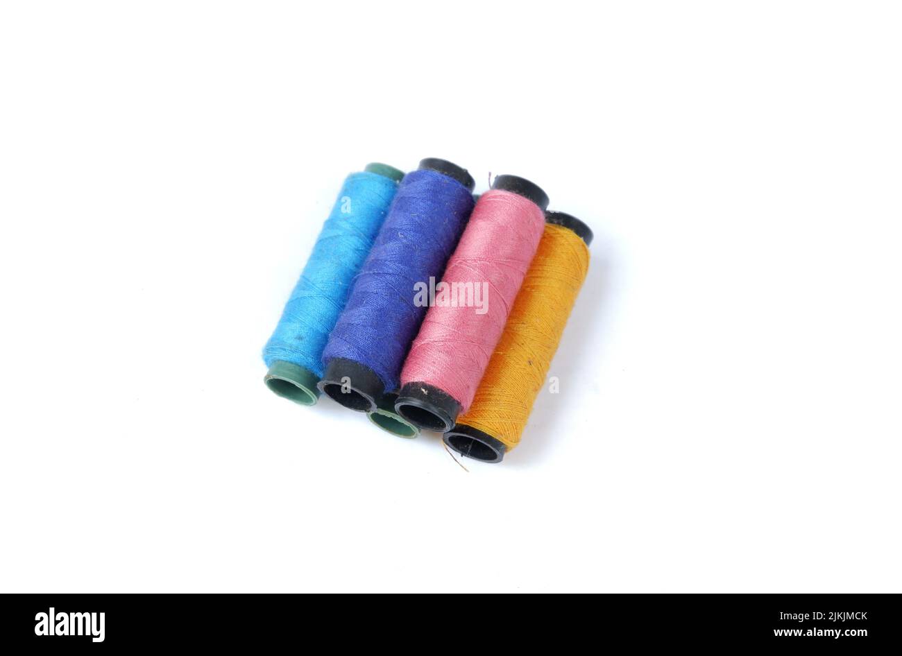 sewing thread isolated on a white background Stock Photo - Alamy