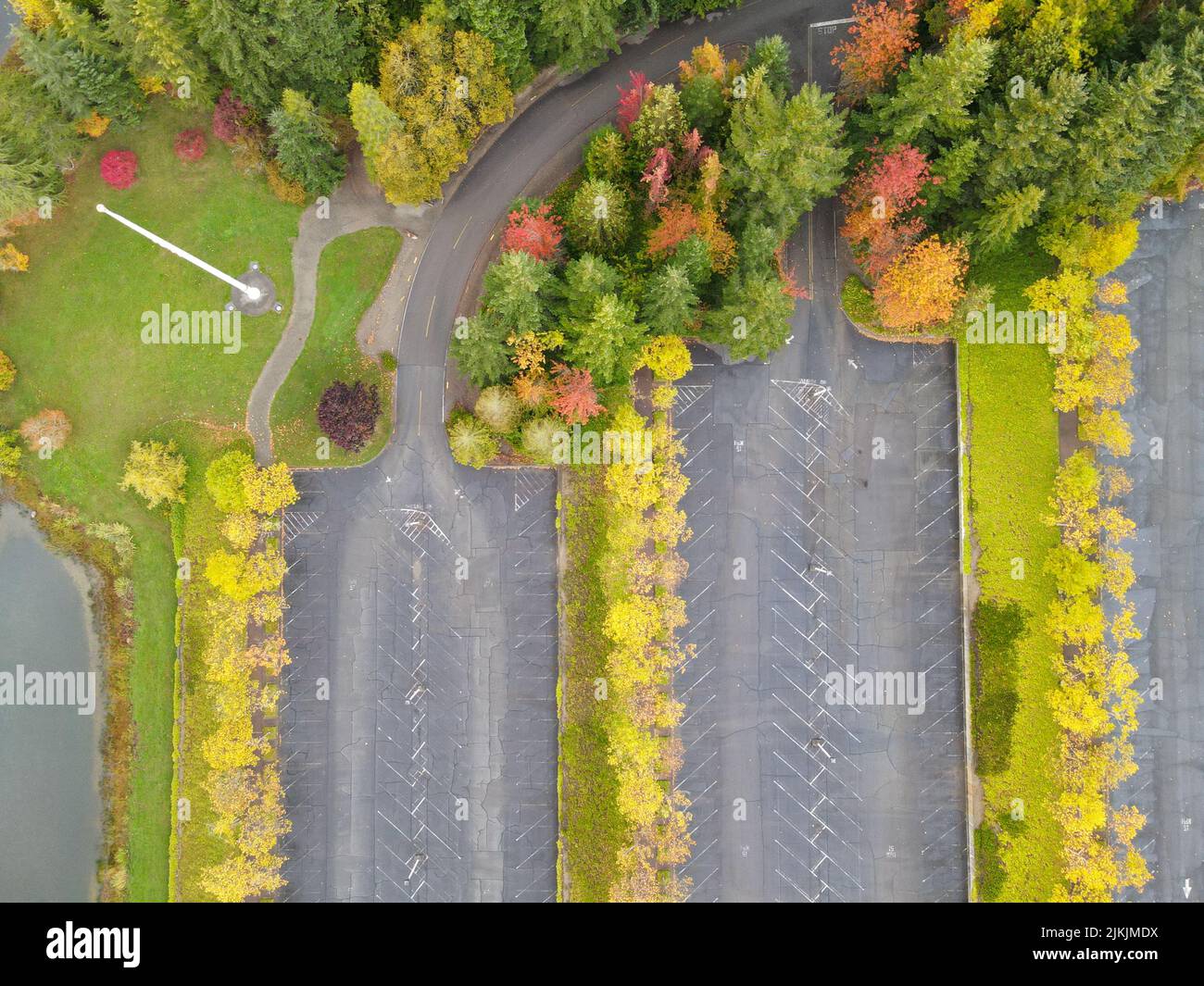 An aerial view of an empty parking space surrounded by beautiful ...