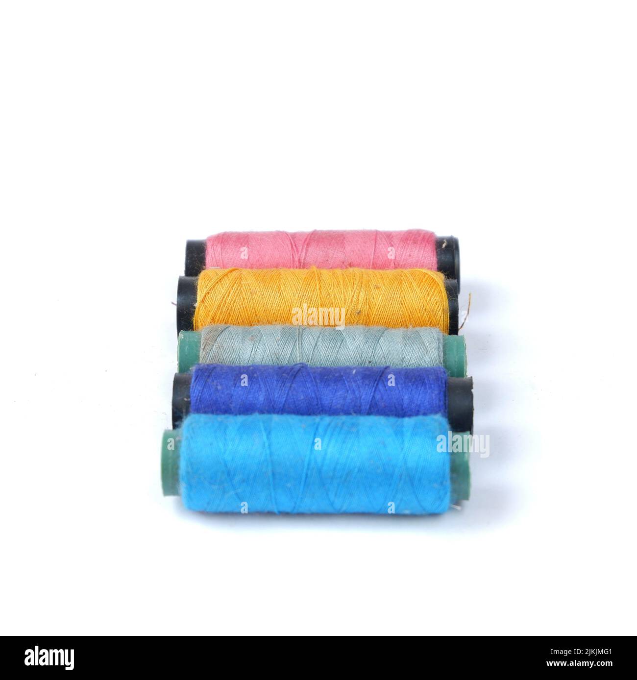 sewing thread isolated on a white background Stock Photo - Alamy
