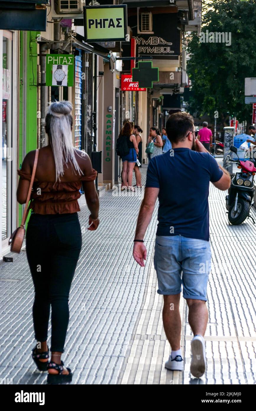 Mixed couple walking in the street, Thessaloniki, Macedonia, North ...