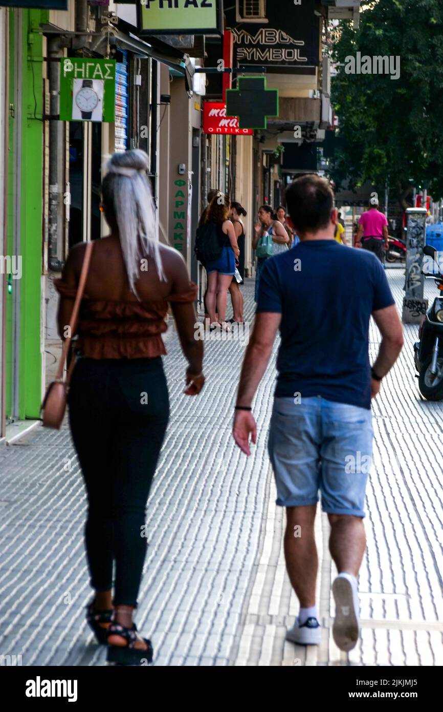 Mixed couple walking in the street, Thessaloniki, Macedonia, North ...