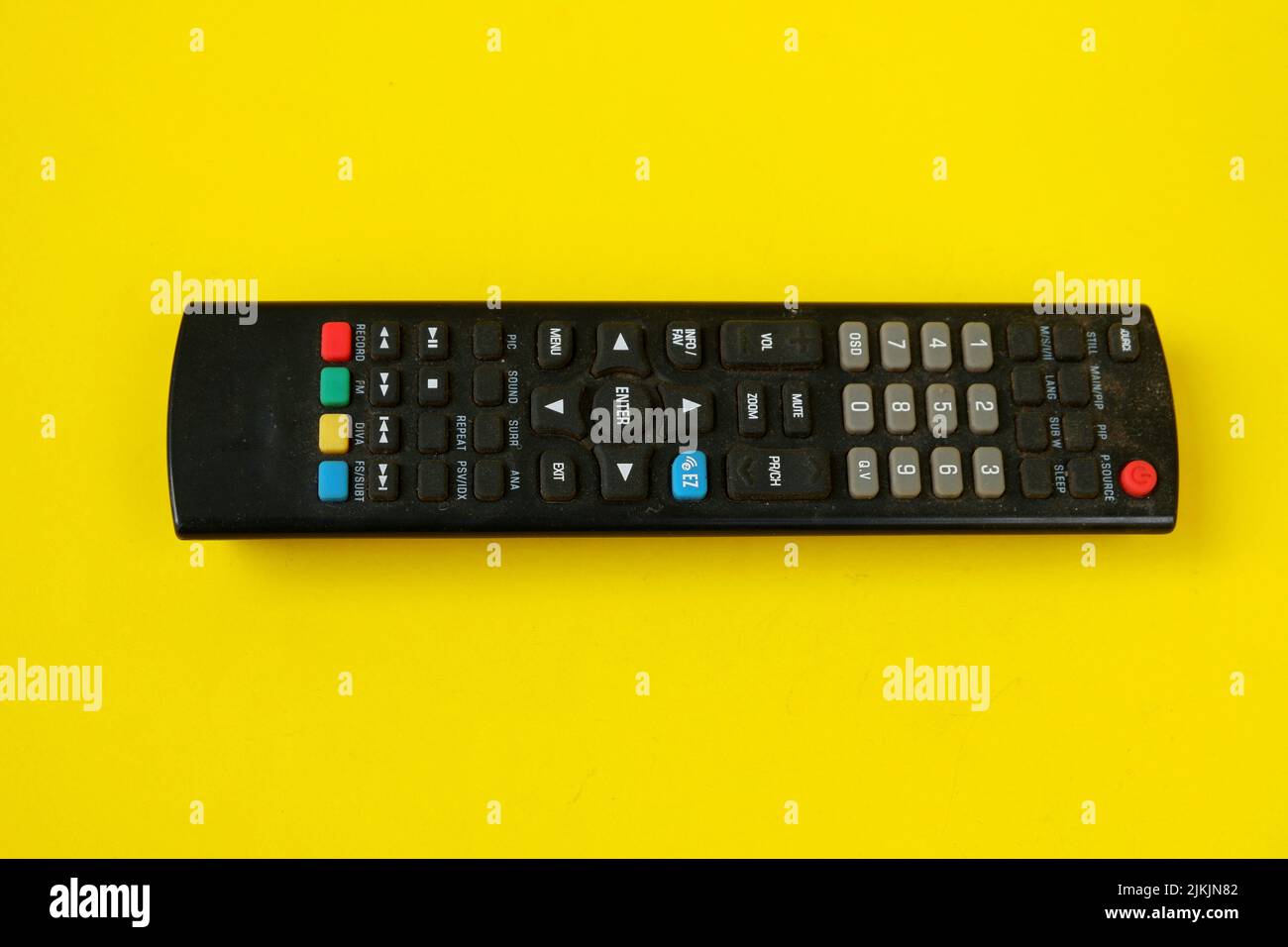 tv remote isolated on yellow background Stock Photo - Alamy