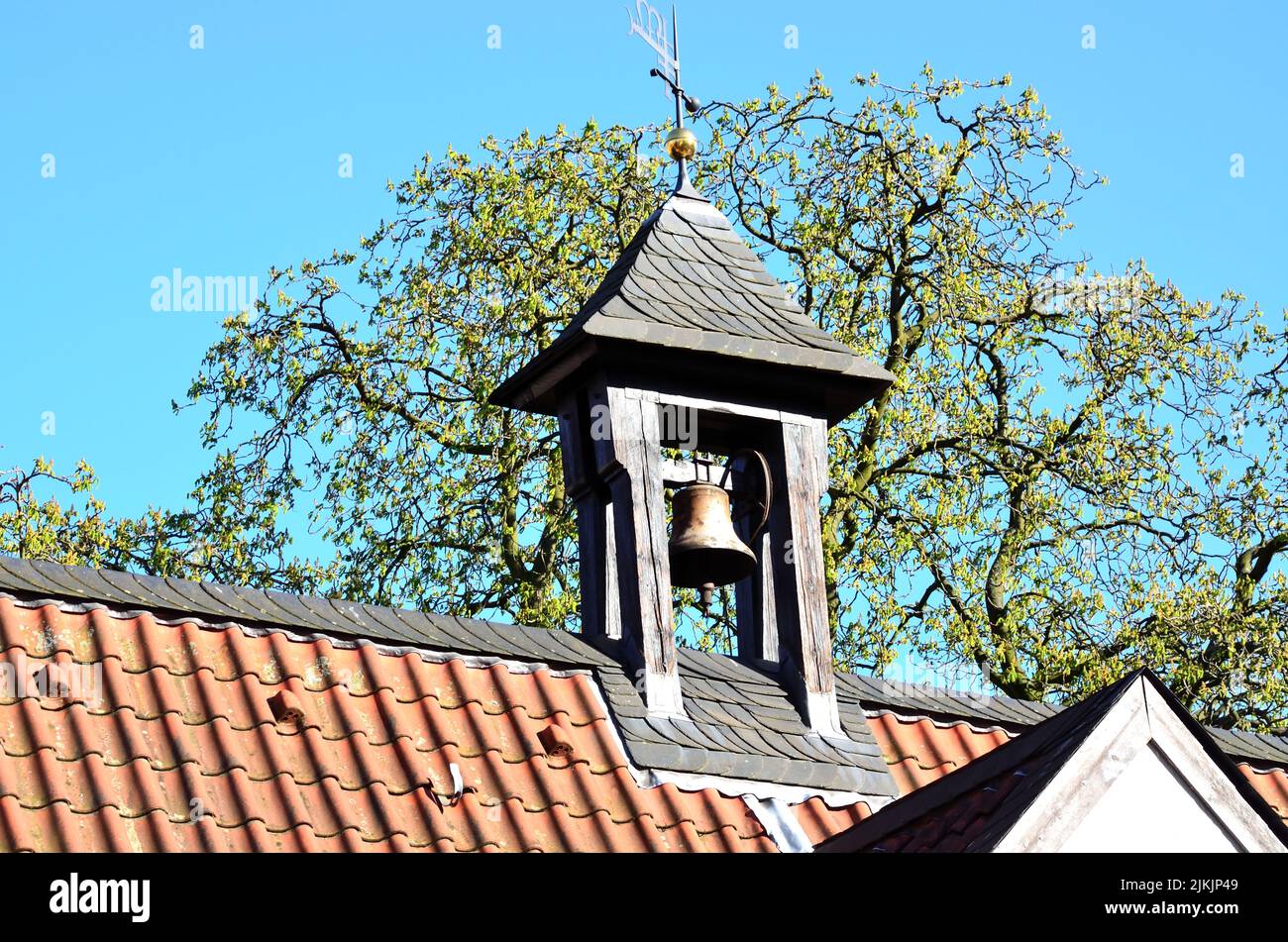 Bell Tower: tower with a bell hung in a belfry on a building roof eye ...