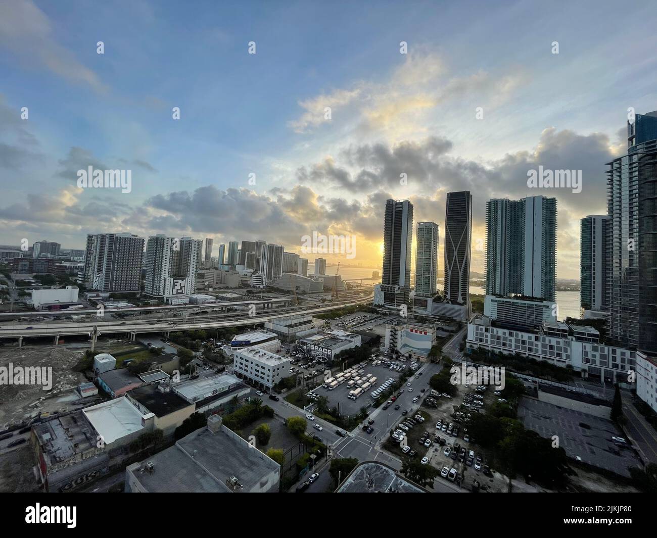 An aerial view of the beautiful Miami skyline during sunrise with the ...