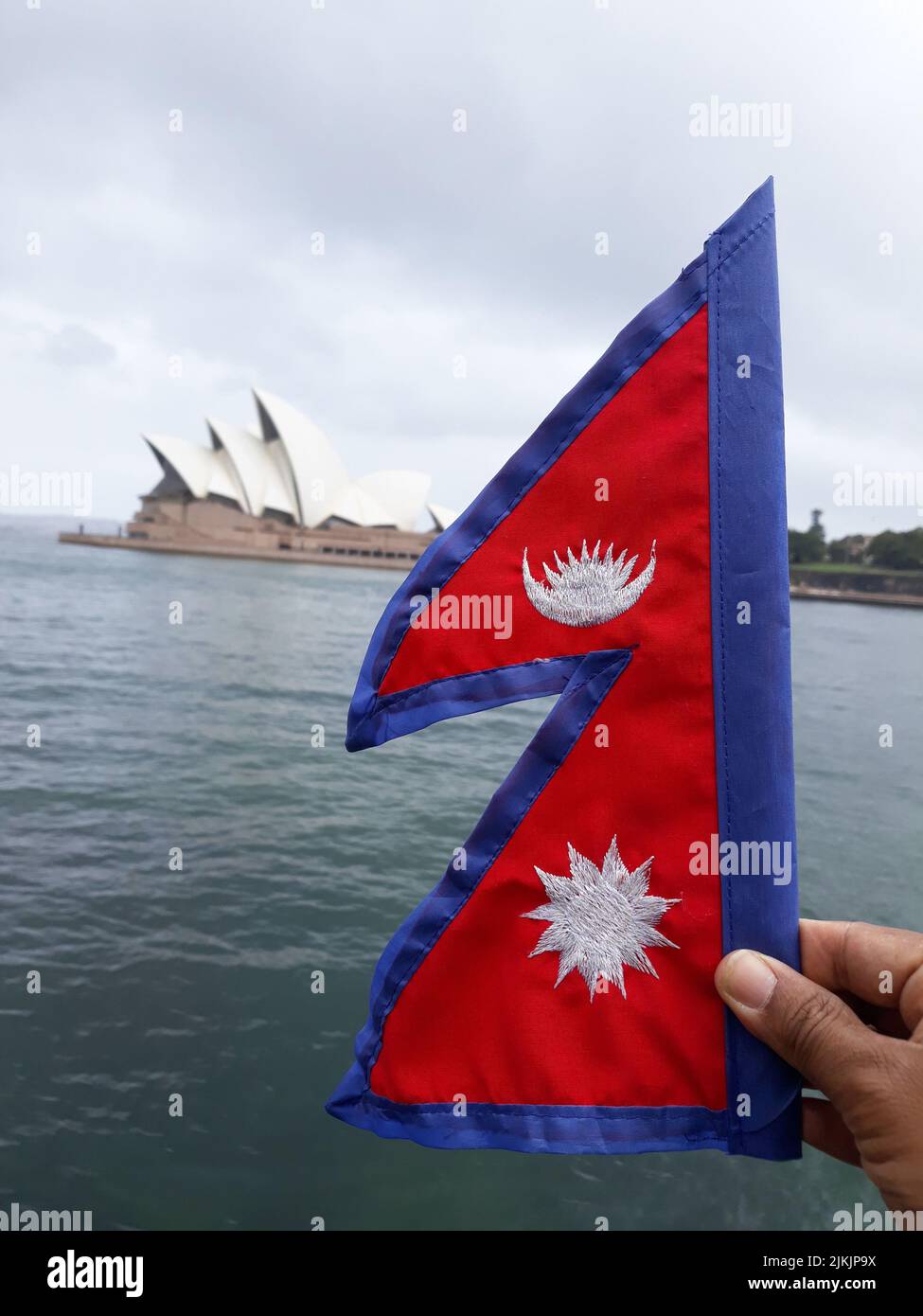 The Nepali flag near Opera House, Sydney, Australia.The national flag ...