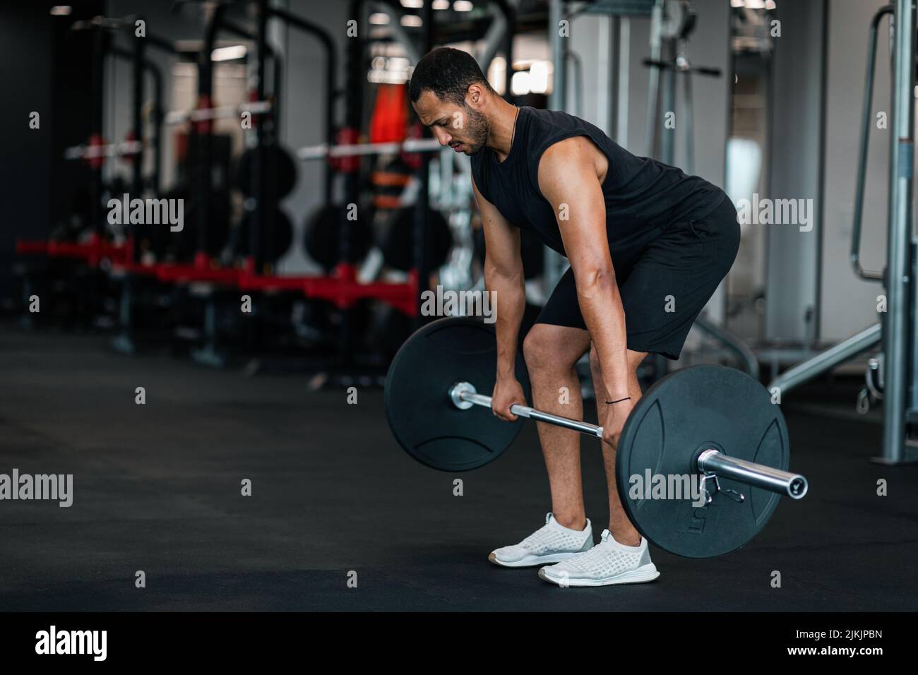 Sporty Black Man Lifting Heavy Barbell While Training At Gym Stock ...
