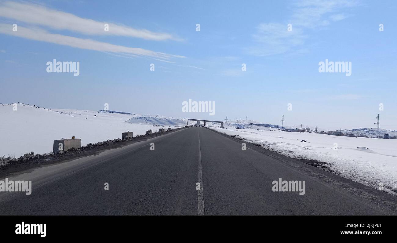 The view of the snowy road in winter Stock Photo - Alamy