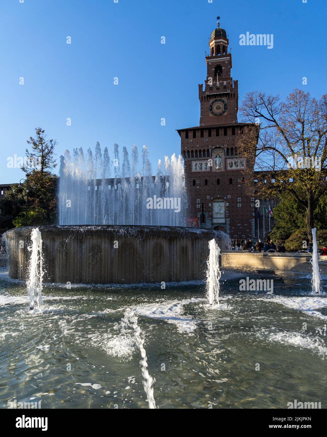 Water fountains in front of the Castello Sforzesco, a medieval castle ...