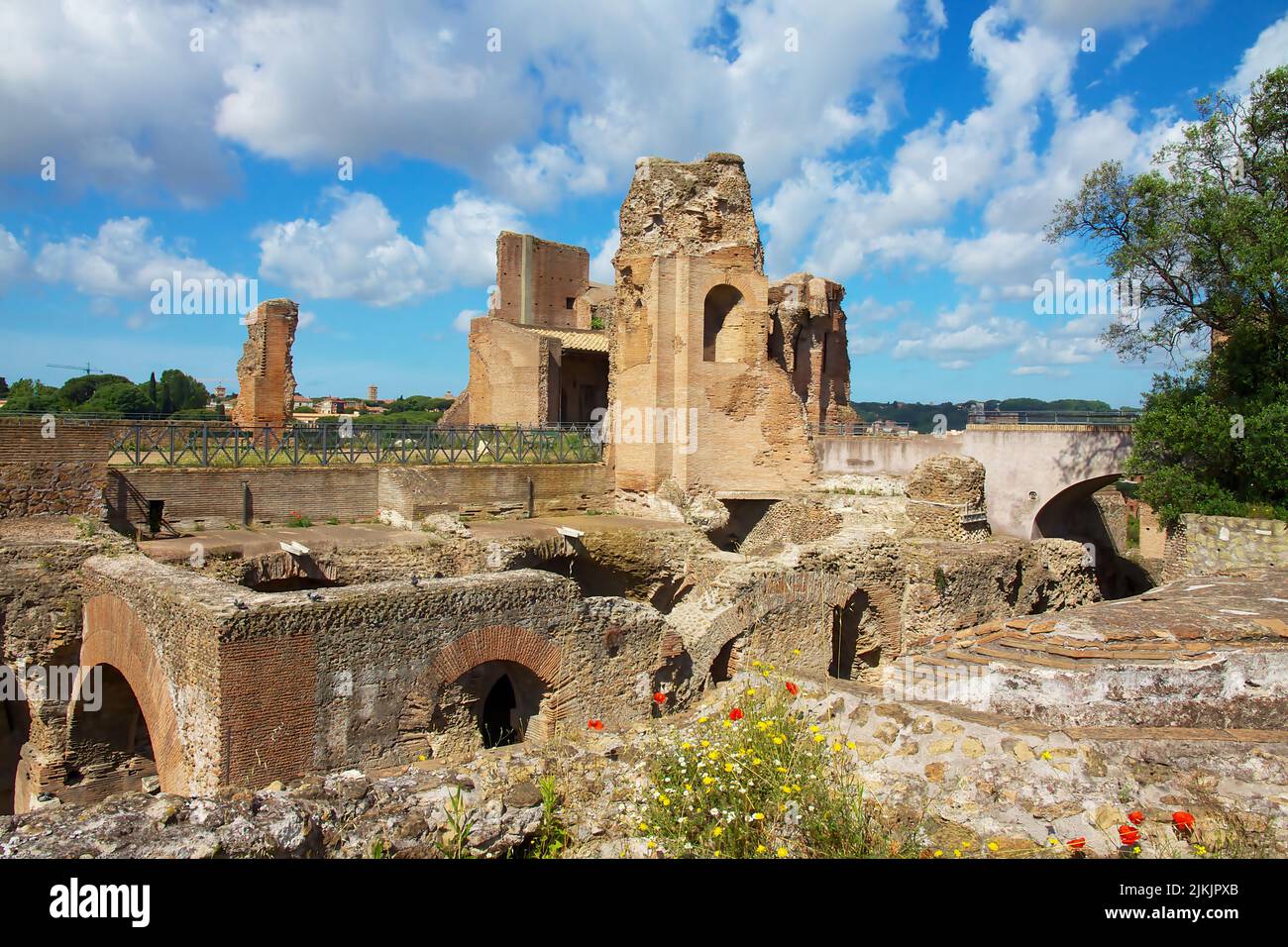 A scenic view of the ruins of Basilica of Maxentius surrounded by ...