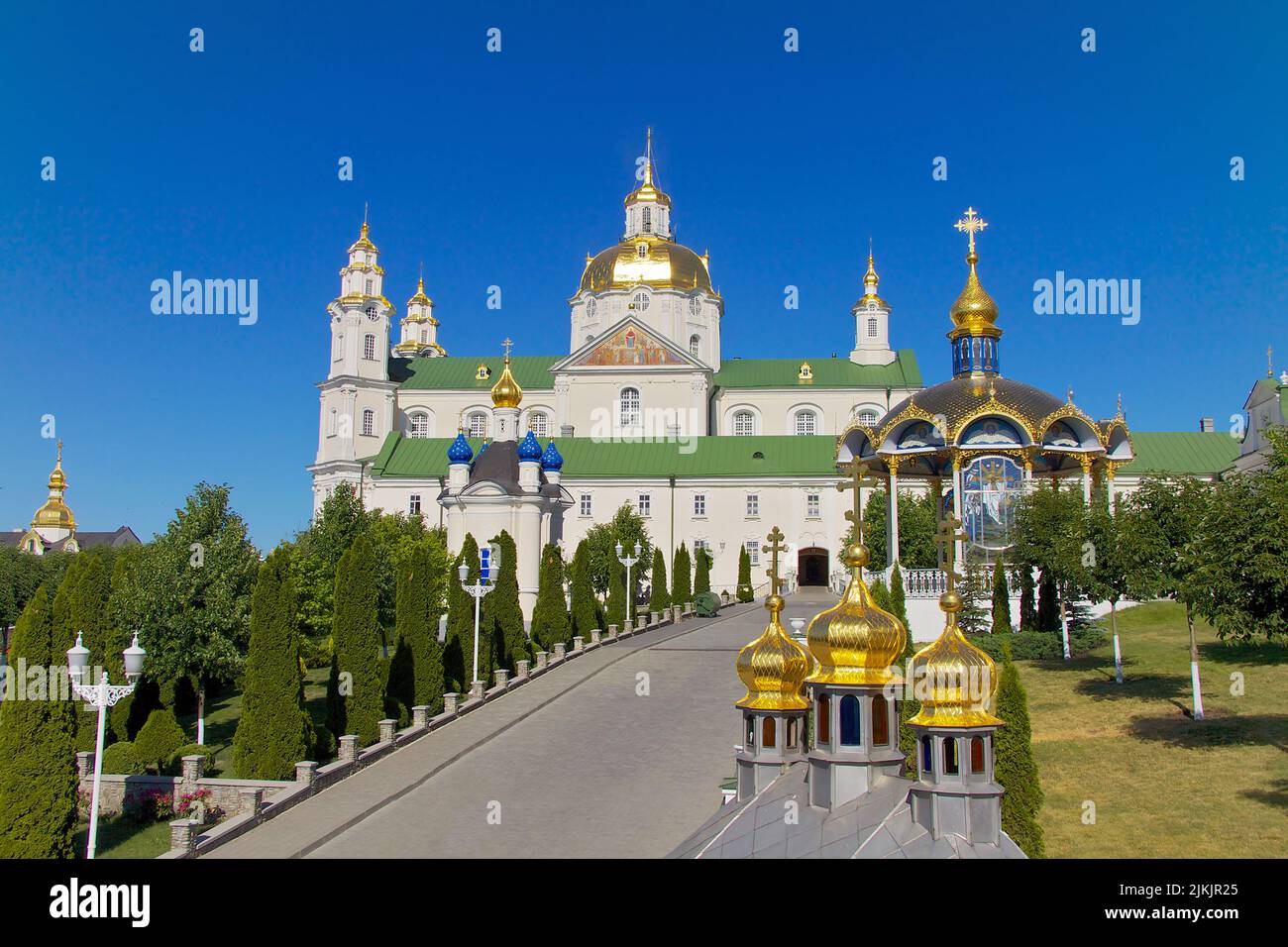 A closeup of a building with golden roof with a park in front Stock ...