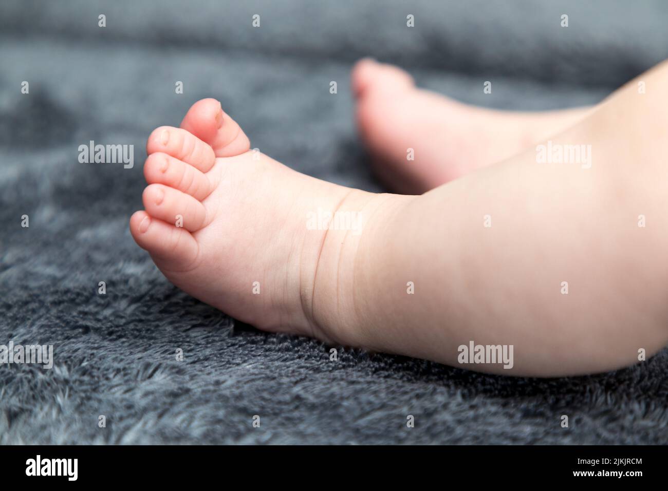 A closeup of the feet of an adorable newborn baby Stock Photo - Alamy