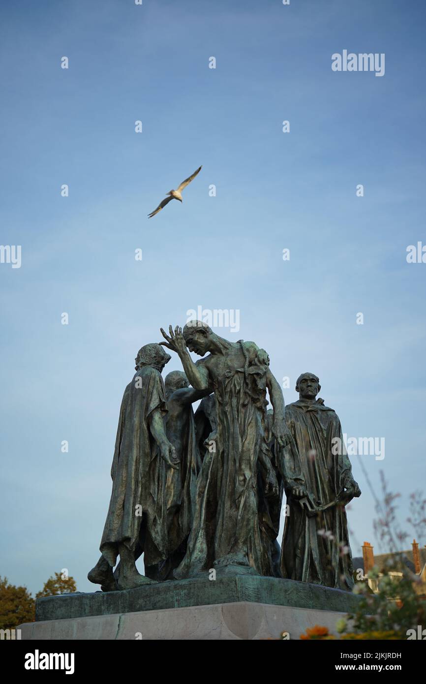The Burghers of Calais statue detail and the Tower on a sunset Stock ...