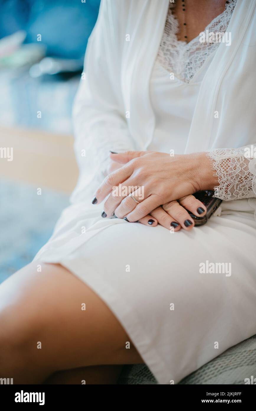girl's hands in her lap Stock Photo - Alamy