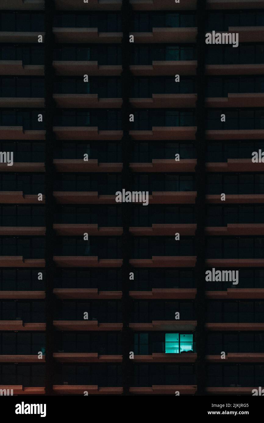 A vertical closeup shot of the residential building with only one ...