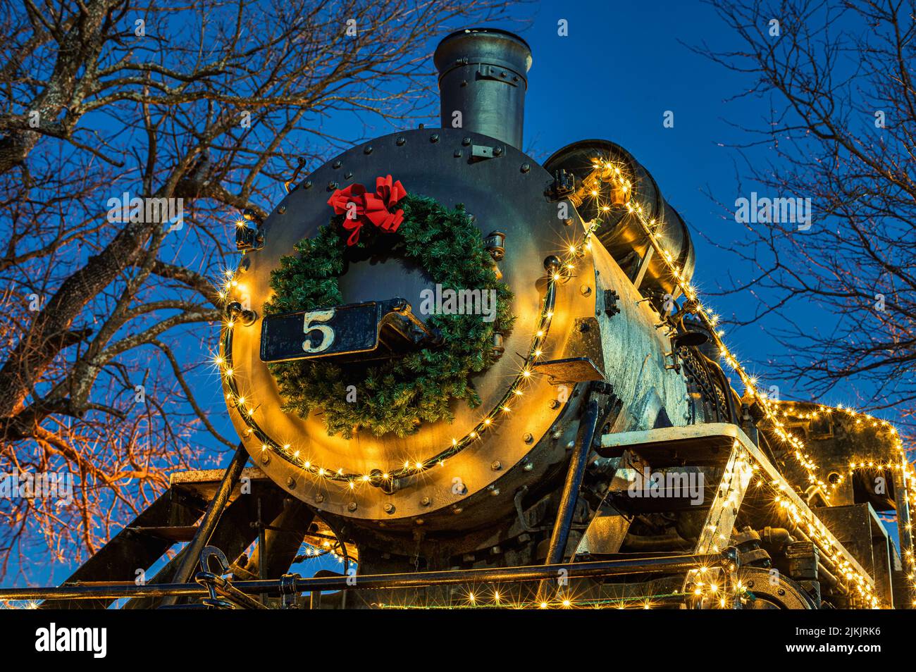 A Railroad Steam Engine with wreath and lights on front for holidays ...