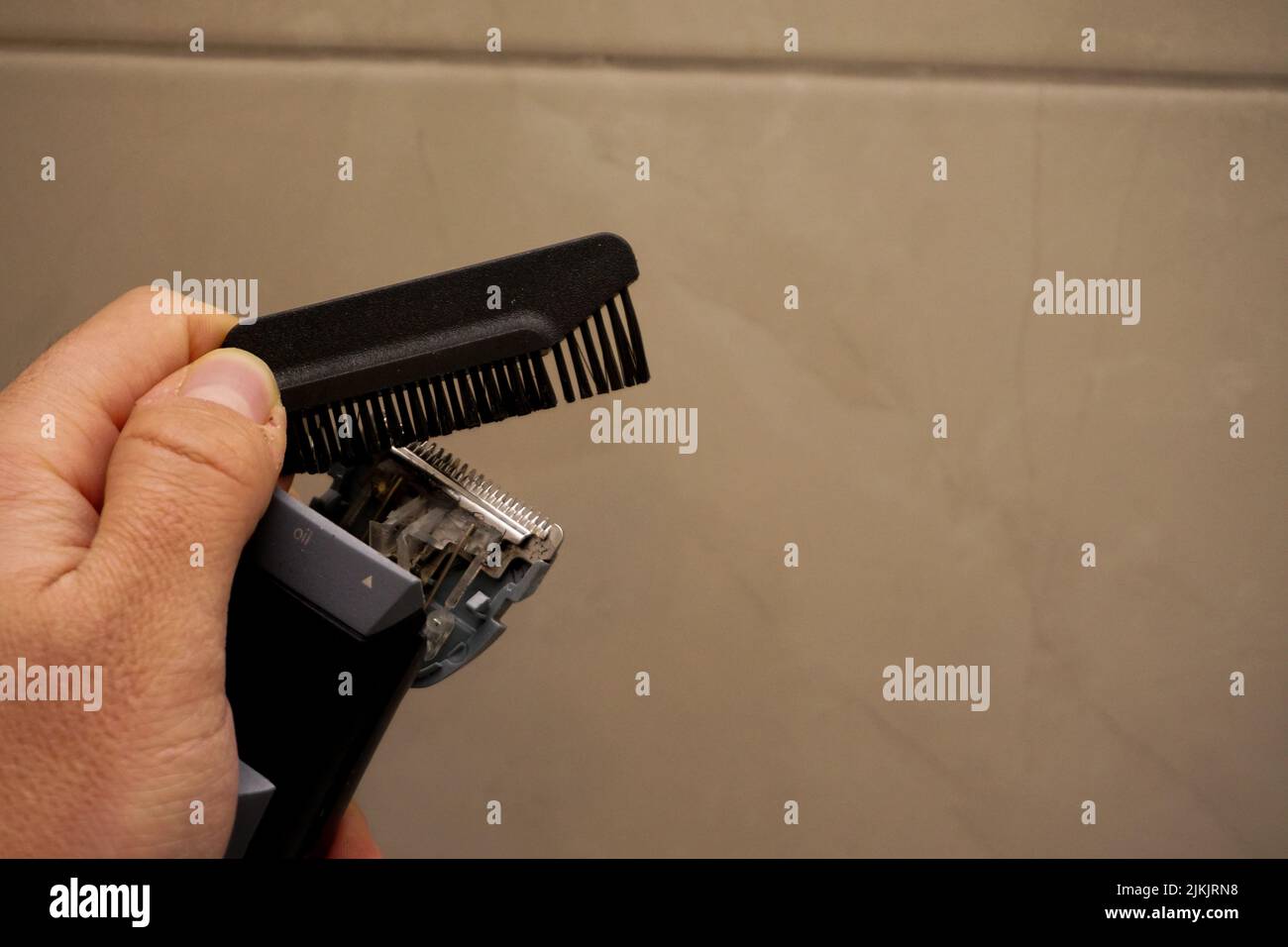 Hair trimmer charge and maintenance close up view Stock Photo - Alamy