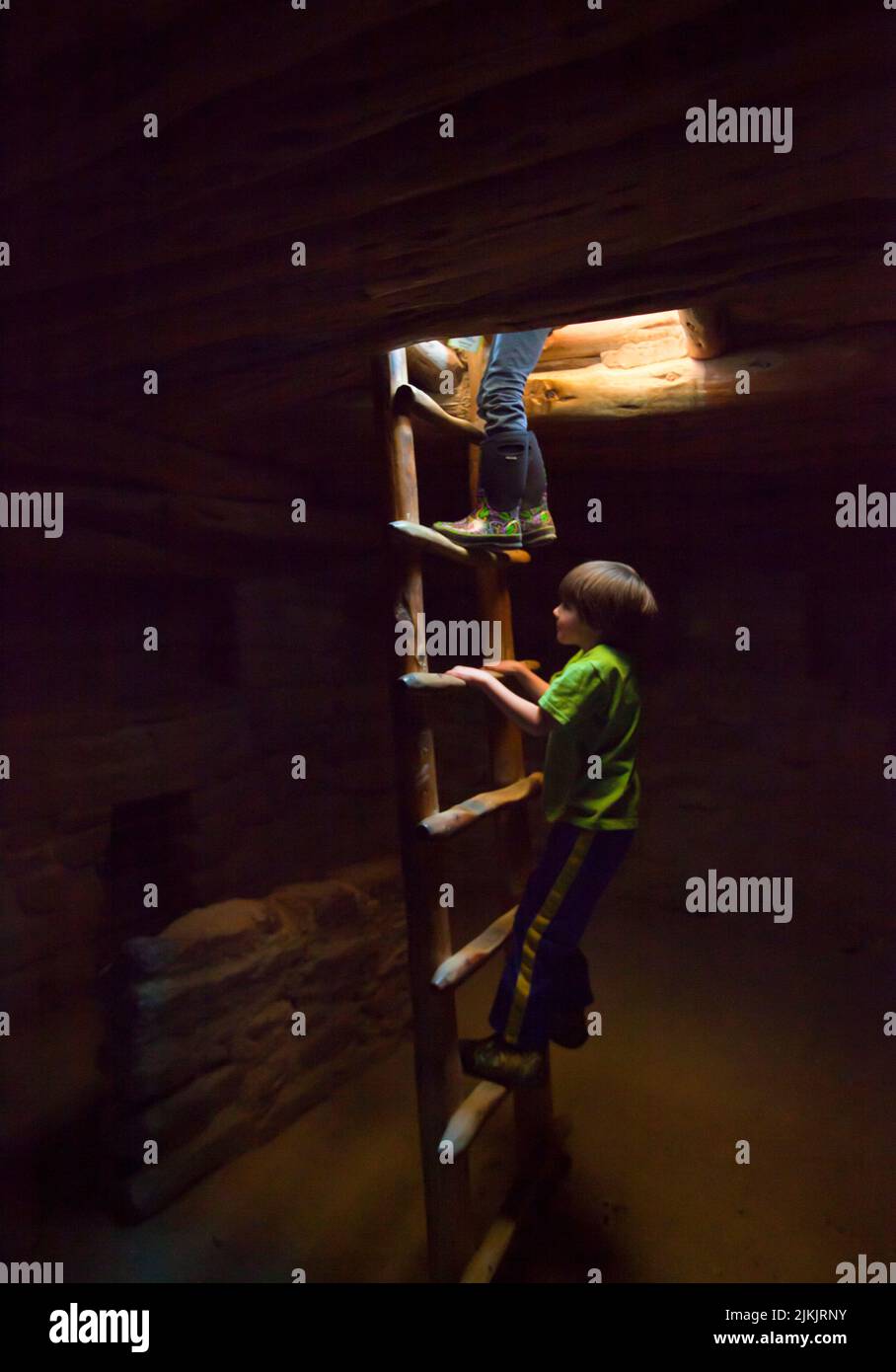 Two children visit Spruce Tree House ruins & climb down wooden ladder ...