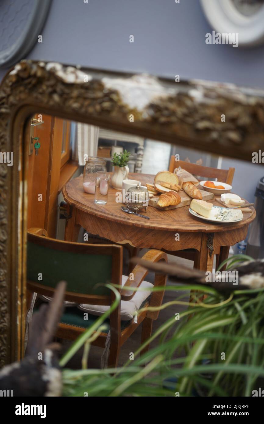 Variety of cheeses and breads on a breakfast table, beautiful lifestyle ...