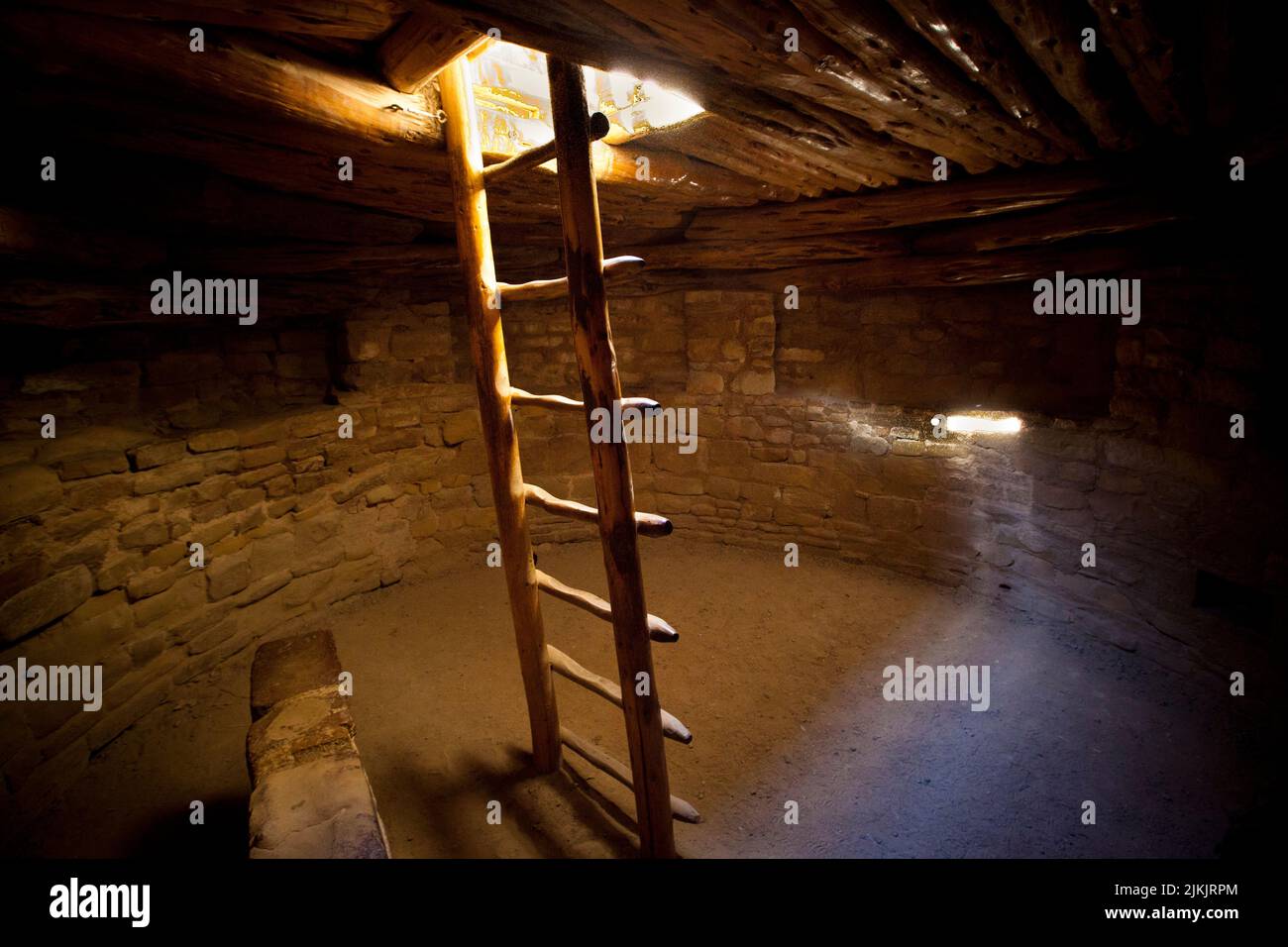 Kiva ladder and doorway open up to a beam of sunlight that fills the ...