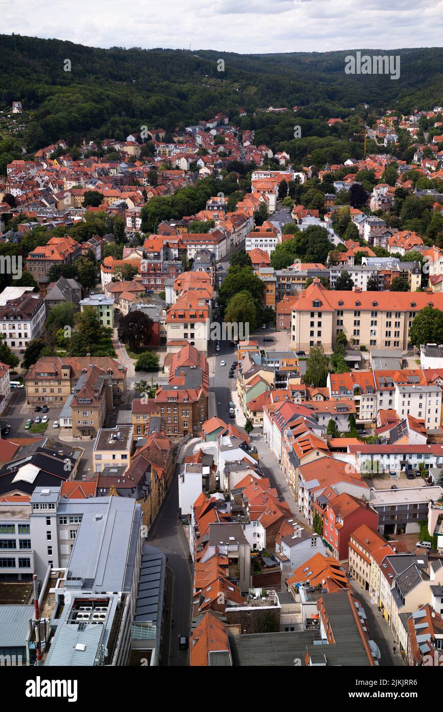 A vertical high angle shot of beautiful buildings with red roofs in ...