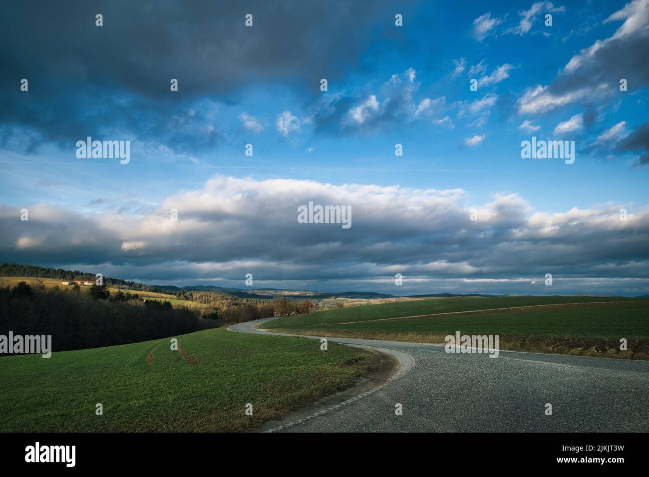 A spring landscape with a small estate road in a rural area Stock Photo ...