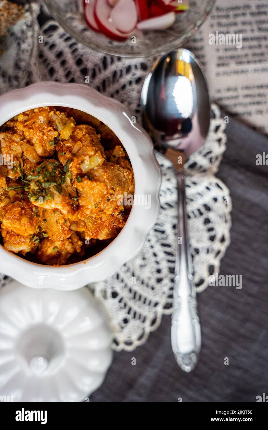 A Shallow focus of a stew soup on a garlic shape white bowl Stock Photo ...